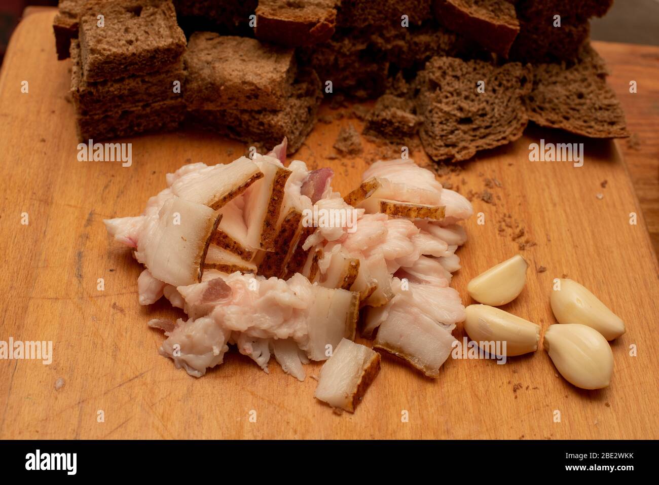 Traditional Russian snack. Salo bread pickles. Two glasses of tomato ...