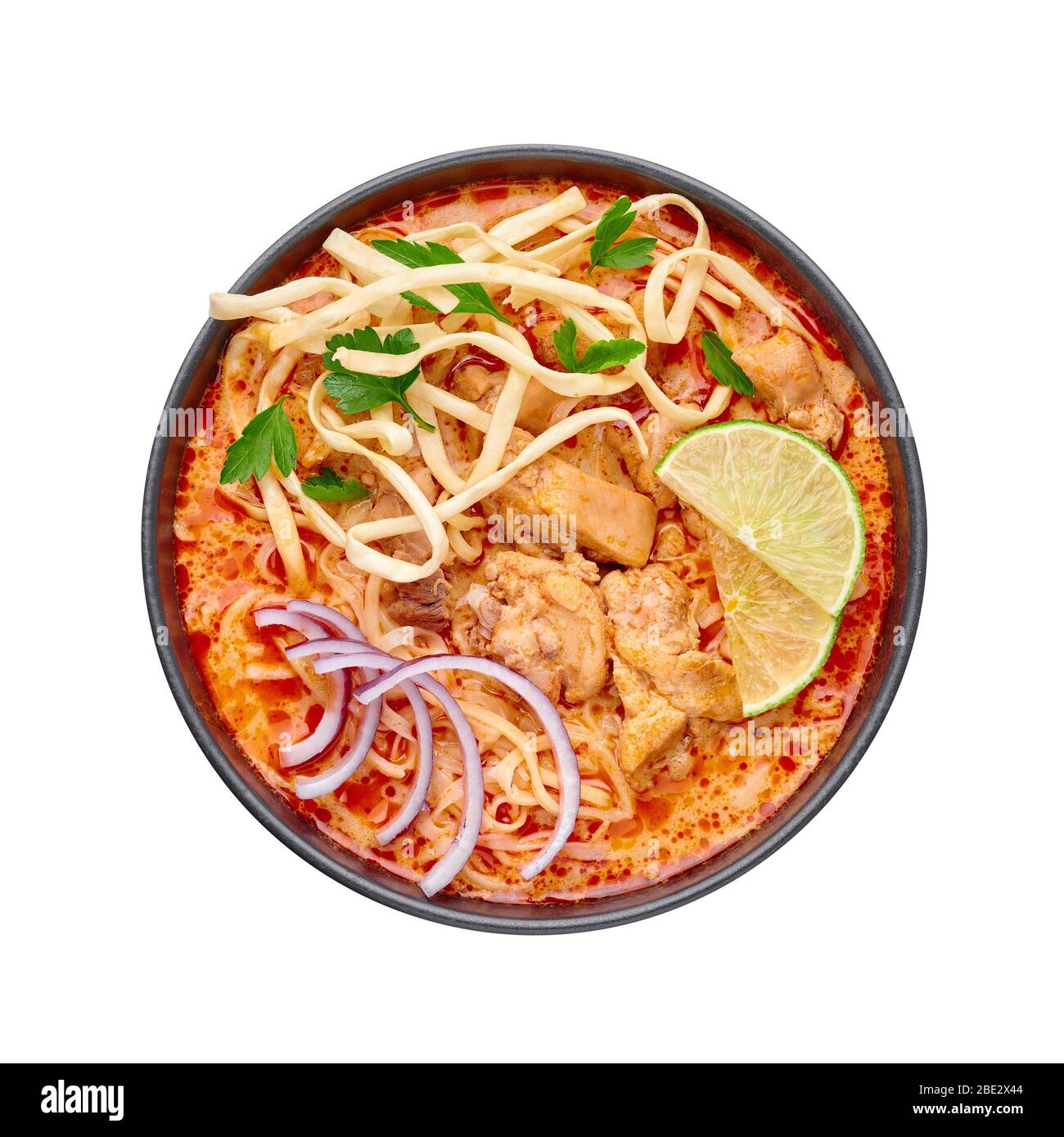 Khao Soi Gai or Thai Coconut Curry Noodle Soup in black bowl isolated ...