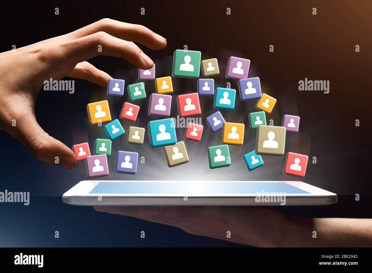 Hand takes people icons from tablet, collage Stock Photo - Alamy