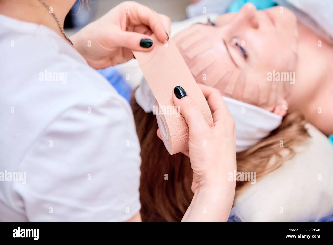 Face taping hi-res stock photography and images - Alamy