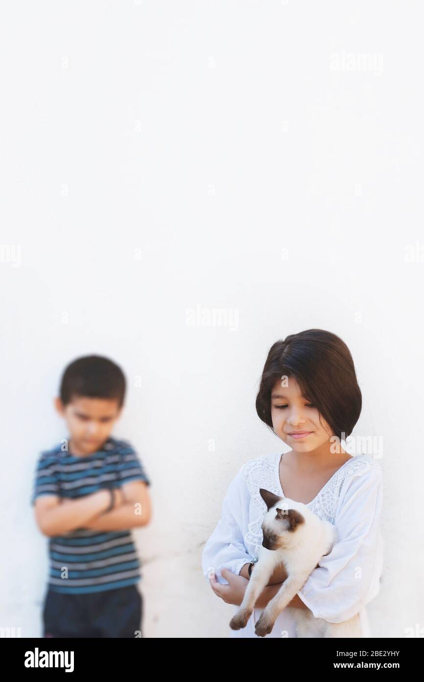 Happy girl hugging lovely kitten. Cute 12 years kid girl holding a ...