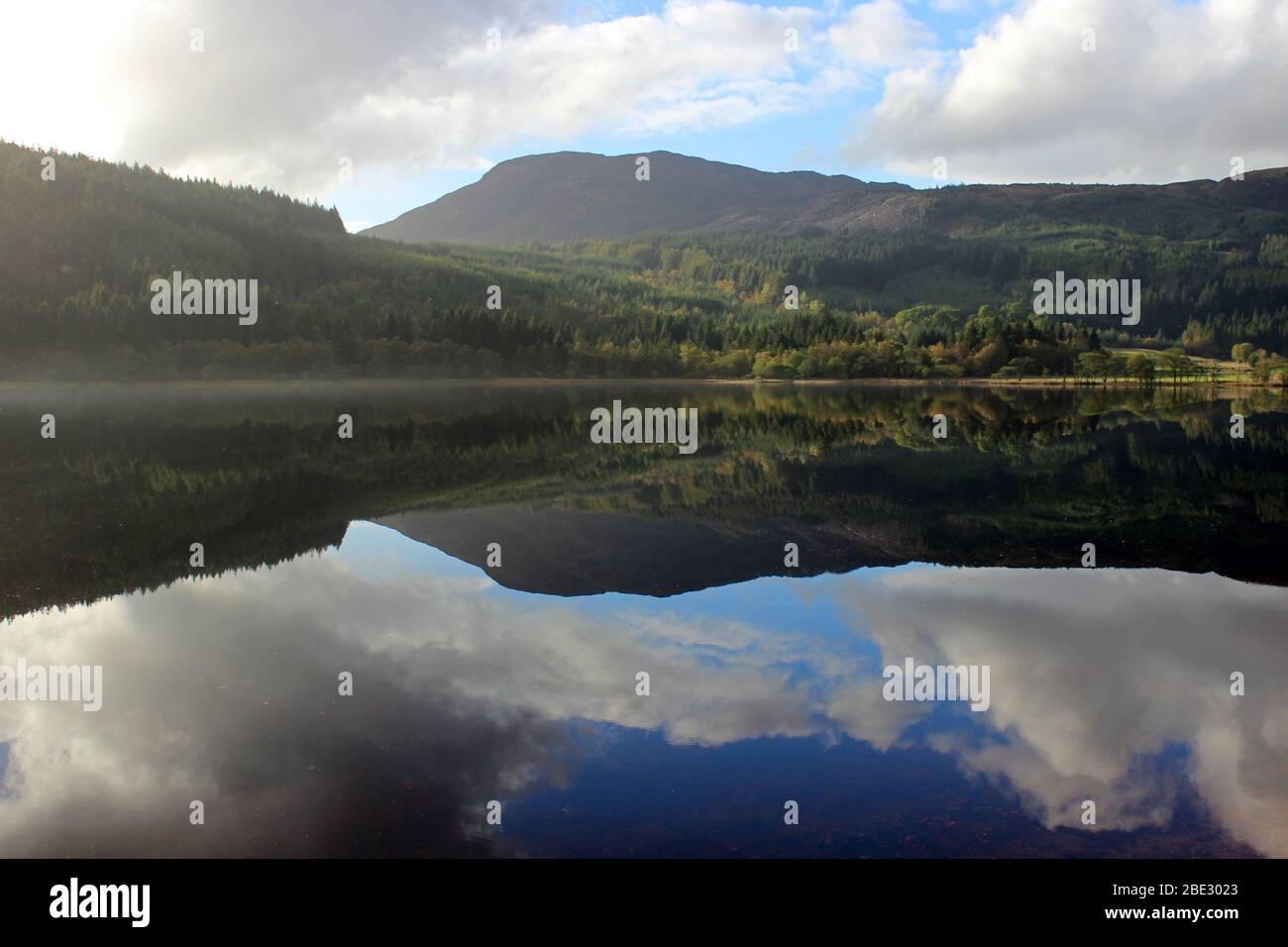 Ben Lomond mountain range reflected in Loch Chon, Trossachs National ...