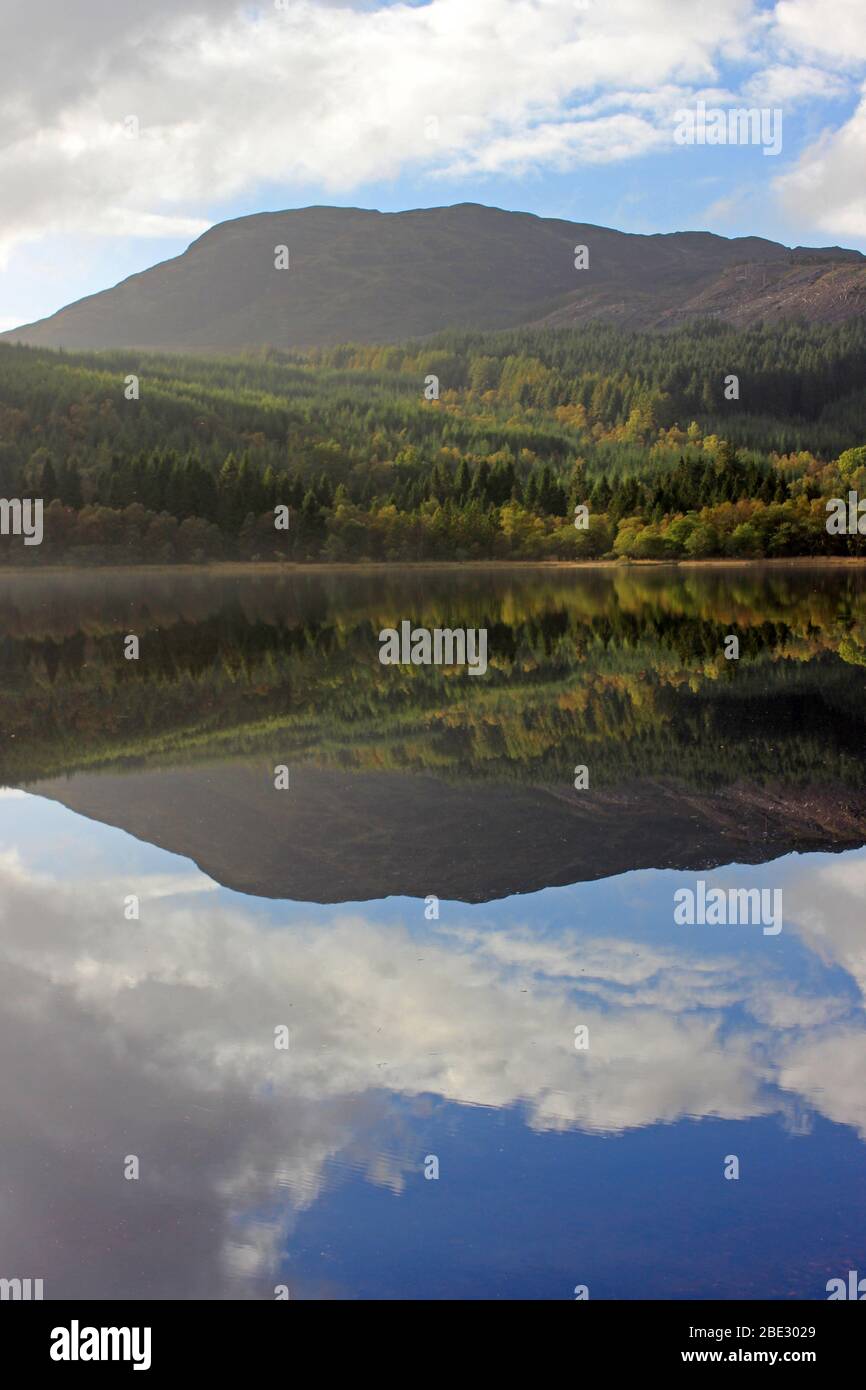 Ben Lomond mountain range reflected in Loch Chon, Trossachs National ...