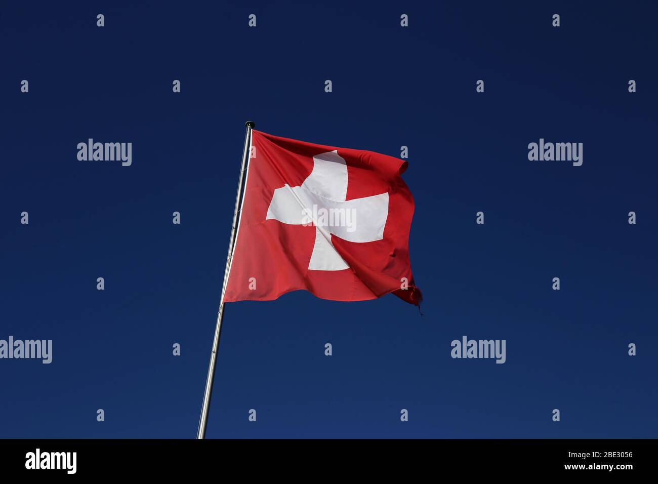 The Swiss flag photographed in Bern, Switzerland during a windy day ...