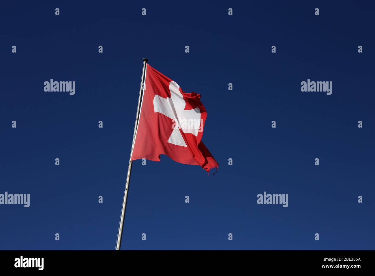 The Swiss flag photographed in Bern, Switzerland during a windy day ...