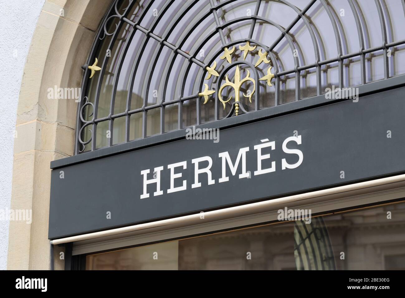 Logo sign of Hermes on a wall of an old building located in downtown ...