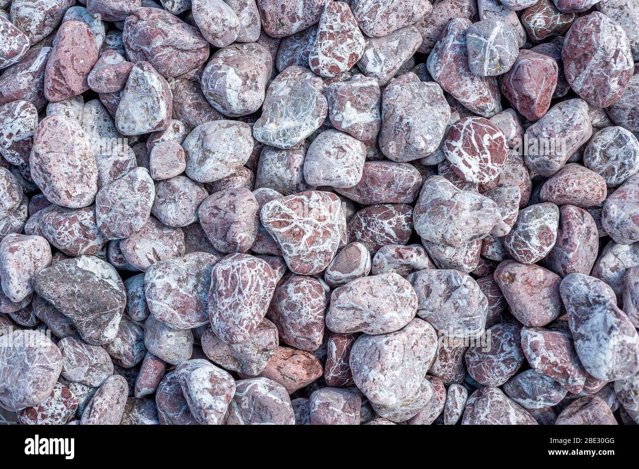 Rounded pebble natural stones texture background Stock Photo - Alamy