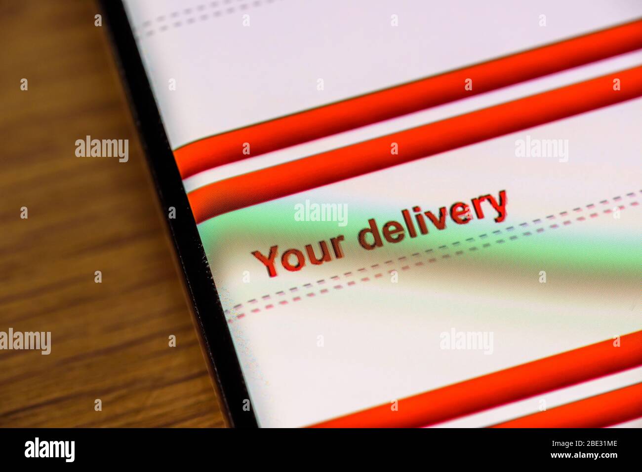 your delivery text on smart phone screen Stock Photo - Alamy