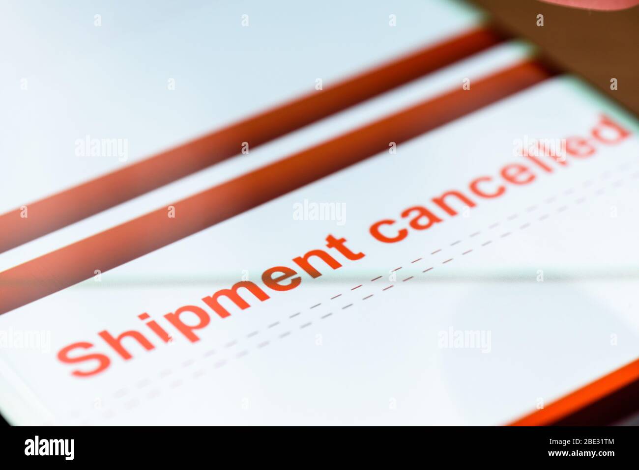shipment cancelled text on smart phone screen Stock Photo - Alamy
