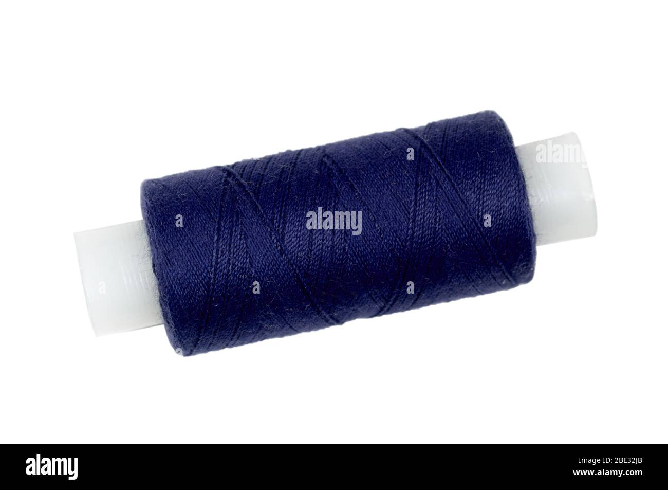 Spool of sewing thread on white background Stock Photo - Alamy