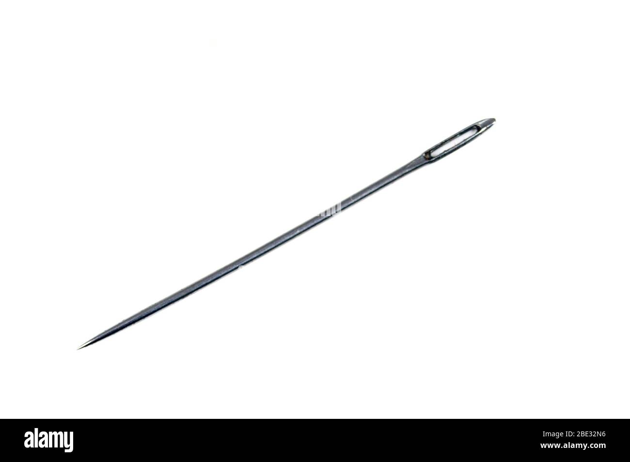 Needle (the tool for sewing) on an isolated white background Stock ...