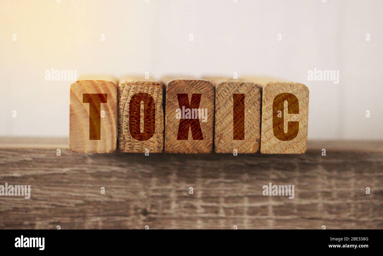 Toxic Word written on wooden cubes. Detox intoxication rehab stop ...