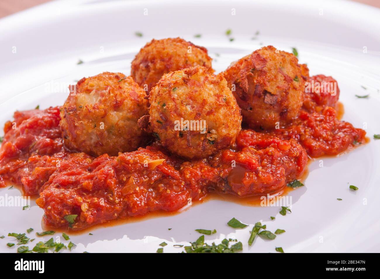Traditional Portuguese Cod Cake with tomato sauce Stock Photo - Alamy