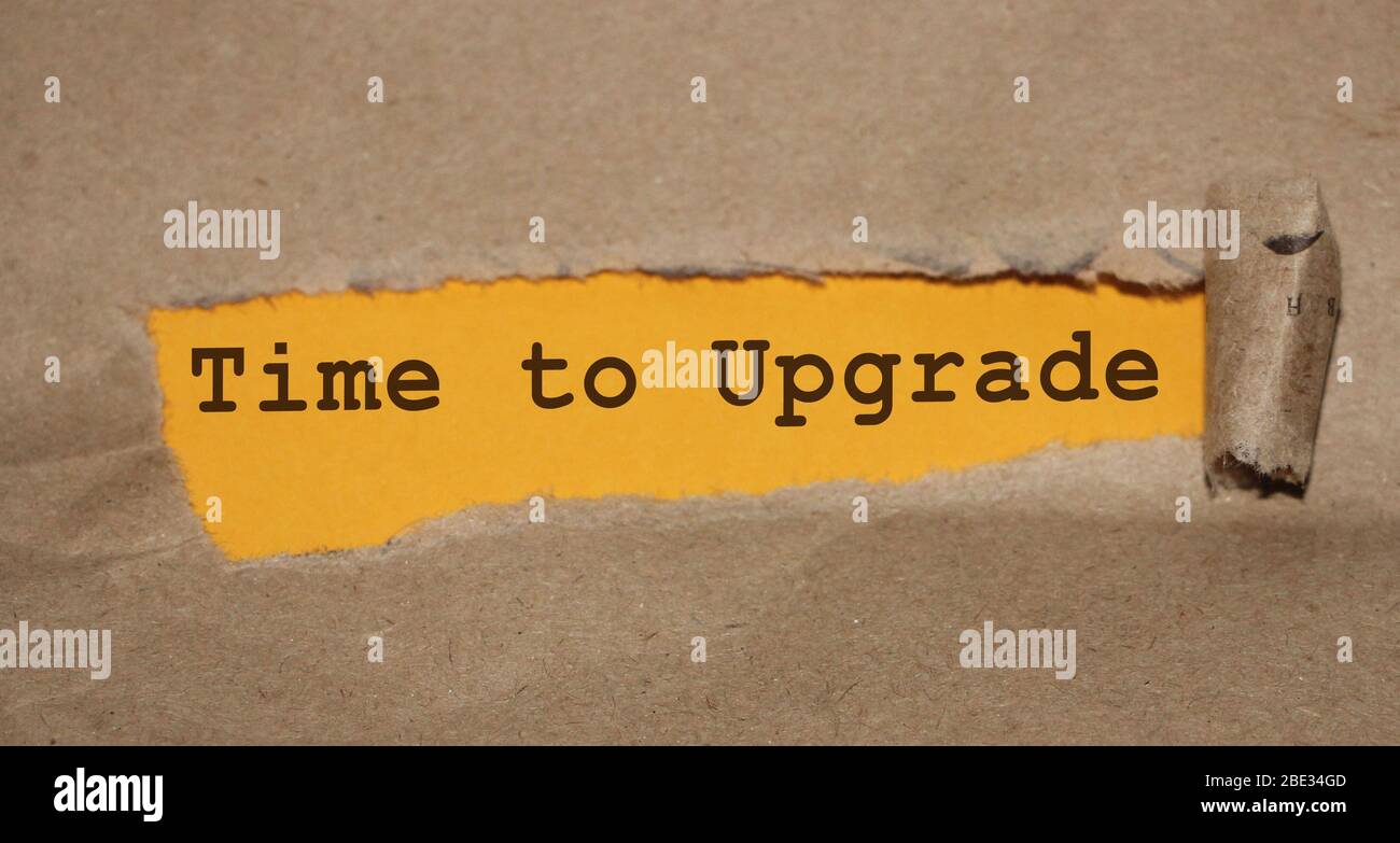 TIME TO UPGRADE written under torn paper. Innovation update in busness ...