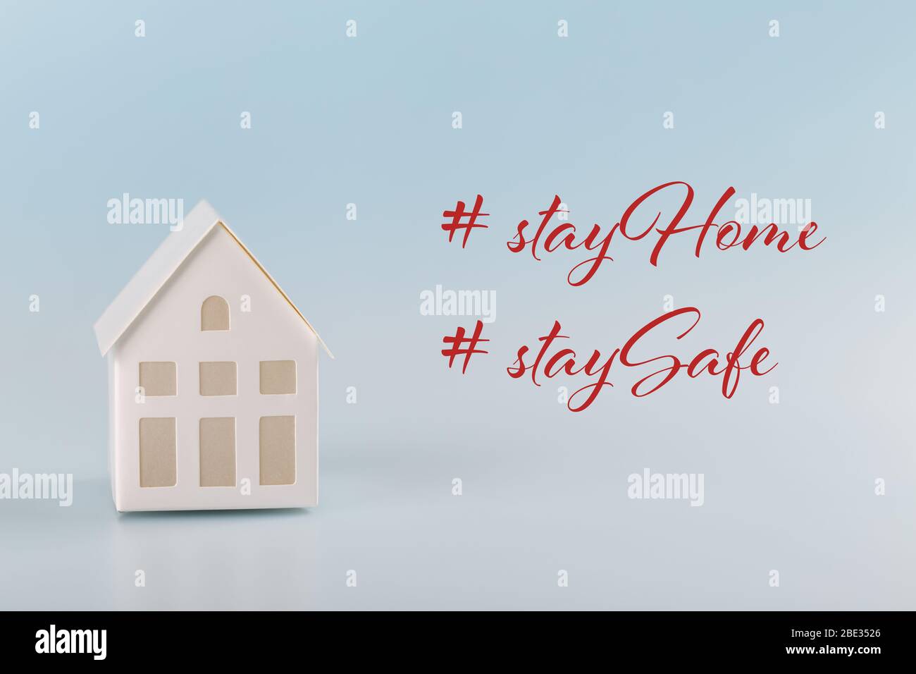 White toy house on blue background, Stay home Stay safe, social media ...