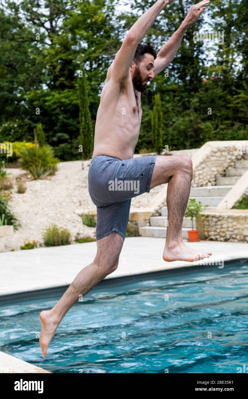 Man makes a spectacular jump into a swimming pool Stock Photo - Alamy
