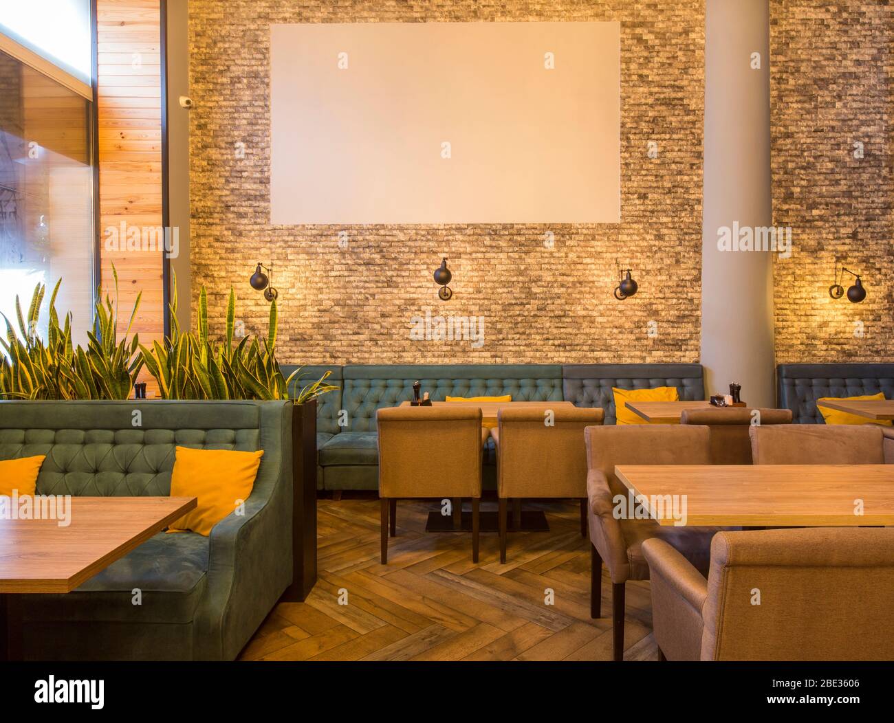 Restaurant in a modern style with textured walls Stock Photo - Alamy