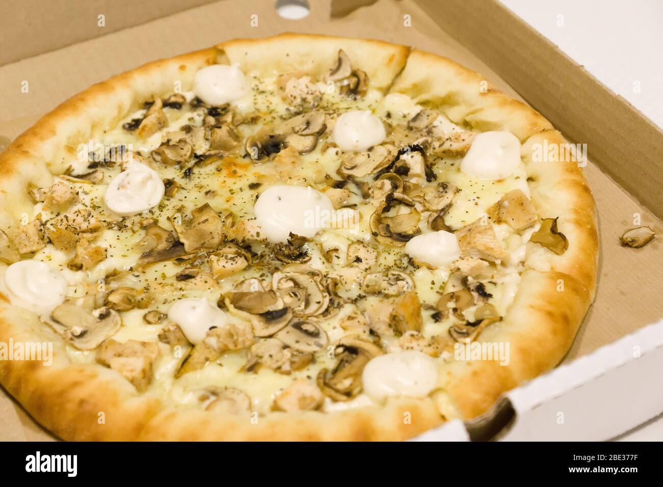 big pizza with mushrooms in a cardboard box Stock Photo - Alamy