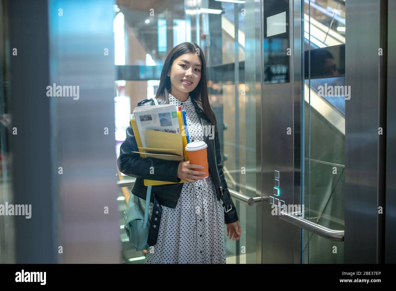 Woman entering elevator hi-res stock photography and images - Alamy