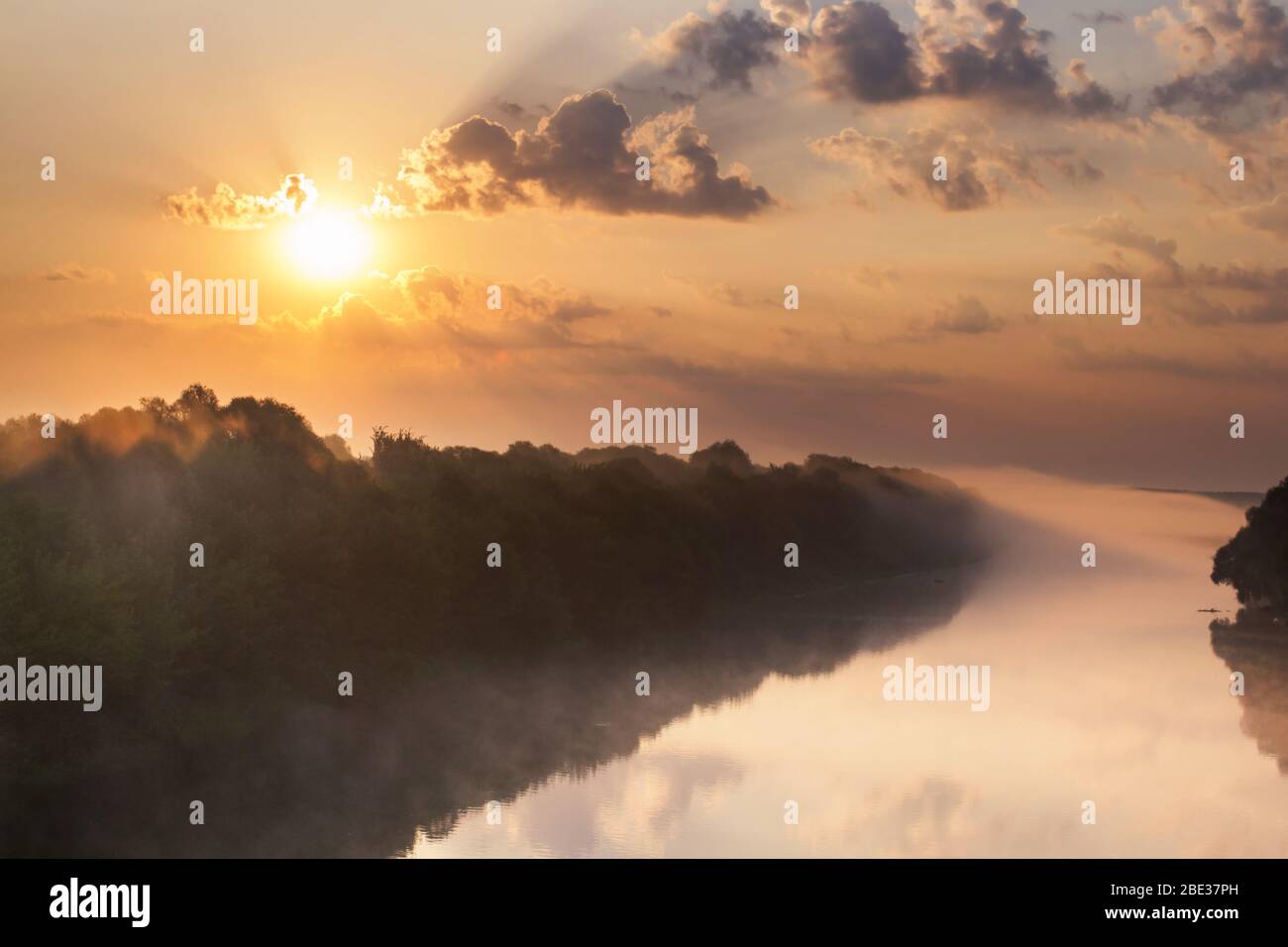 The sky and sun at sunrise on the river in morning Stock Photo - Alamy