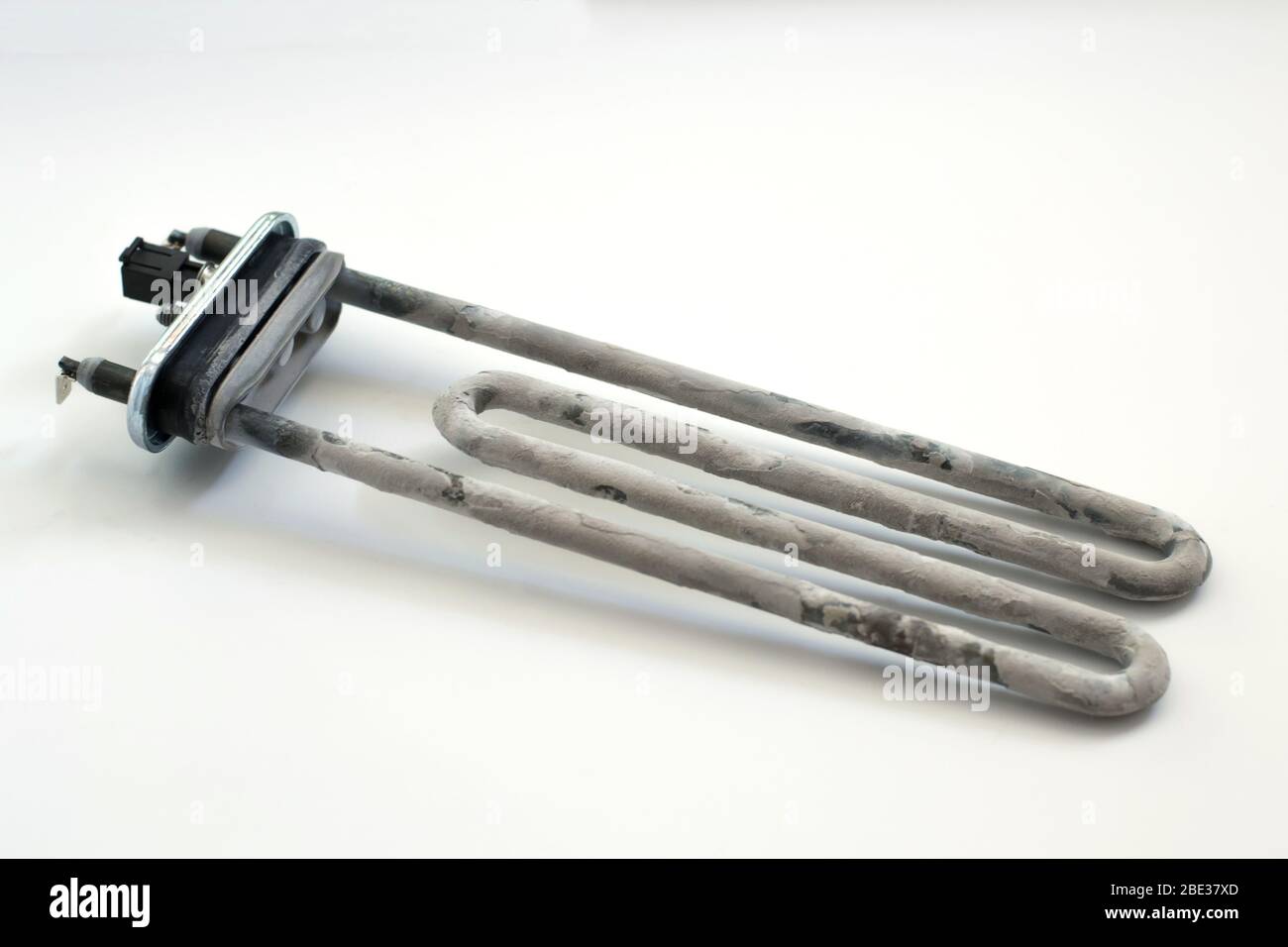 Washing machine heater on a white background Stock Photo - Alamy