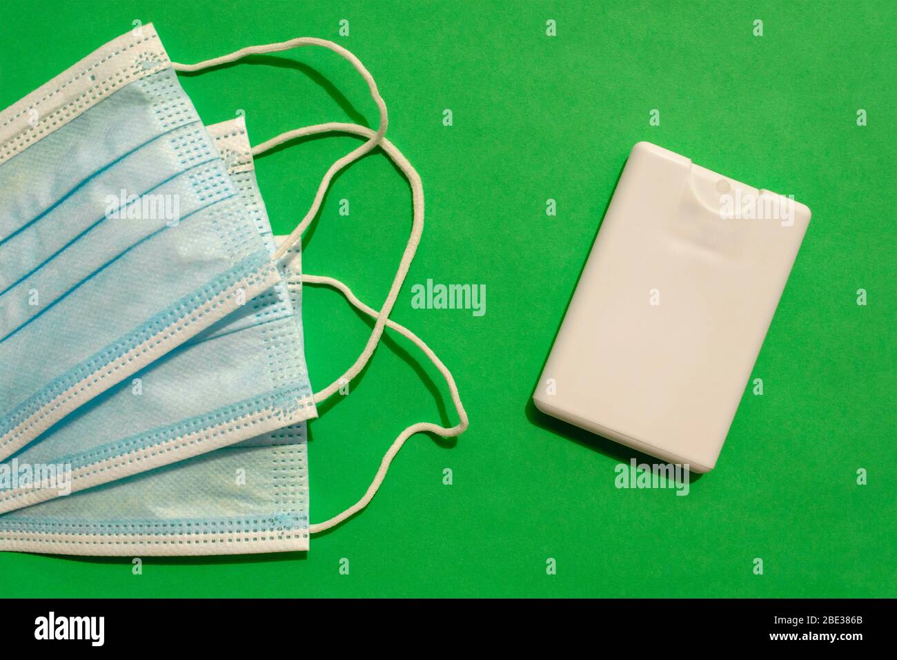 Surgical disposable face masks and hand sanitizer spray in a small ...