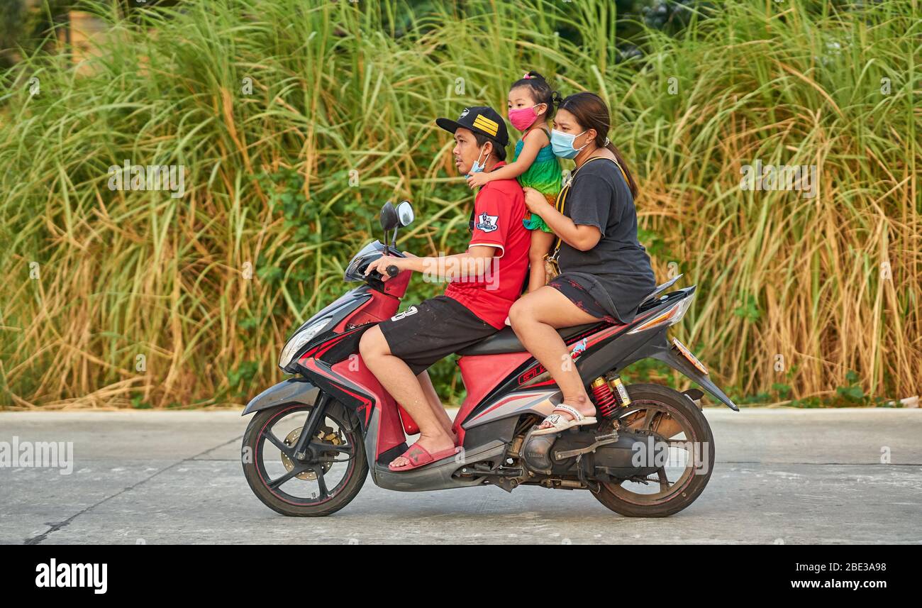 Asian family on a motorbike hi-res stock photography and images - Alamy