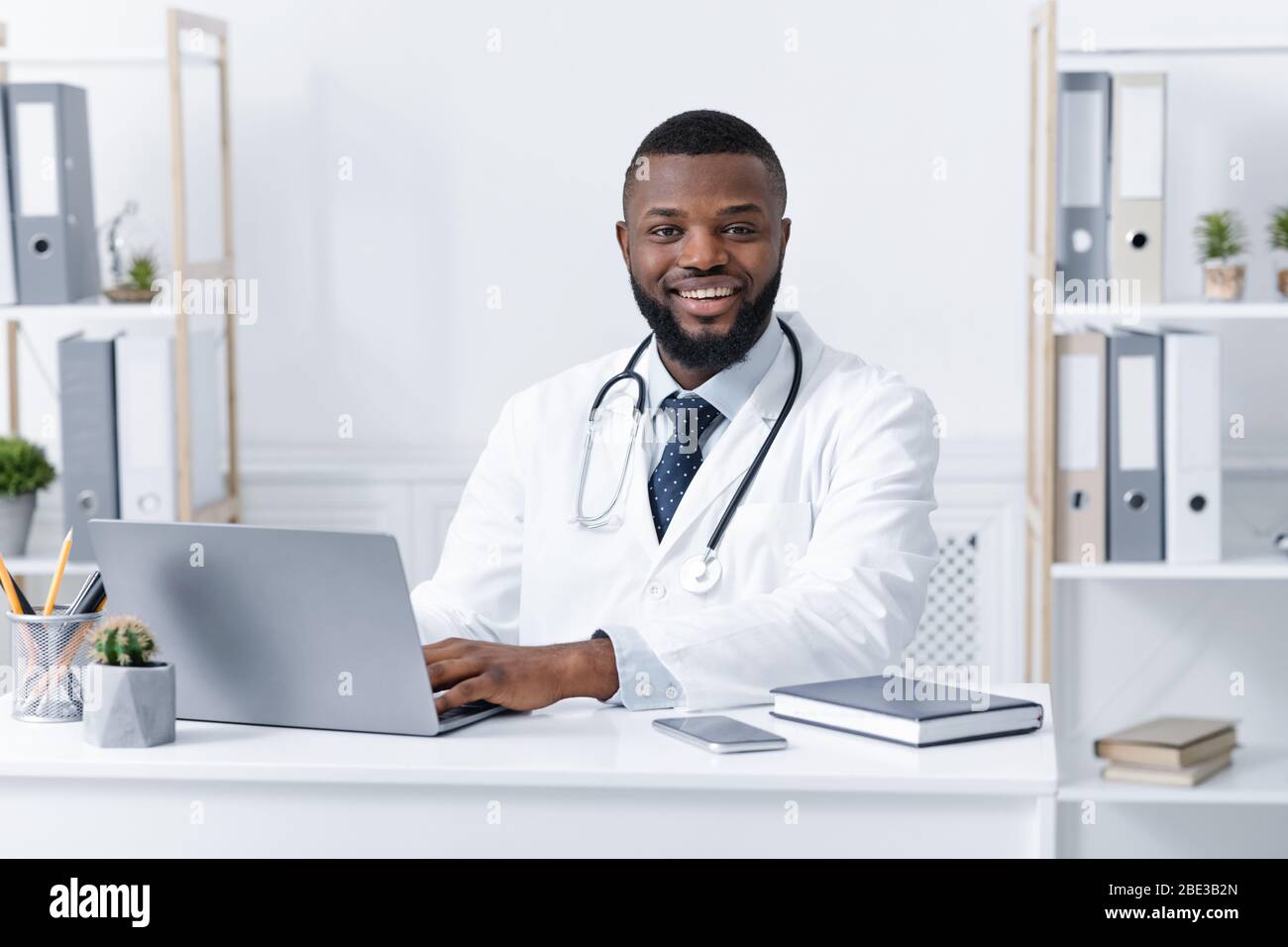 African american therapist doctor typing hi-res stock photography and ...