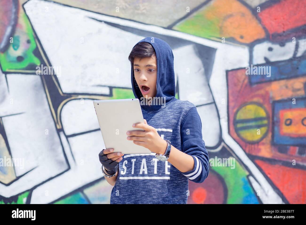 Closeup portrait child, shocked, surprised, funny looking boy using ...