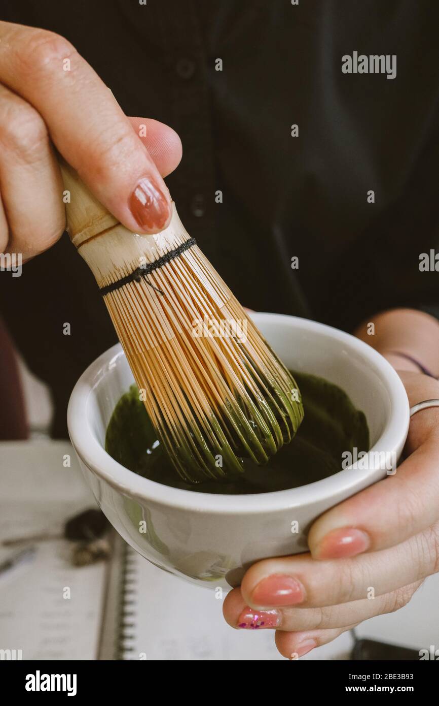 Matcha tea and bamboo matcha whisk Stock Photo - Alamy