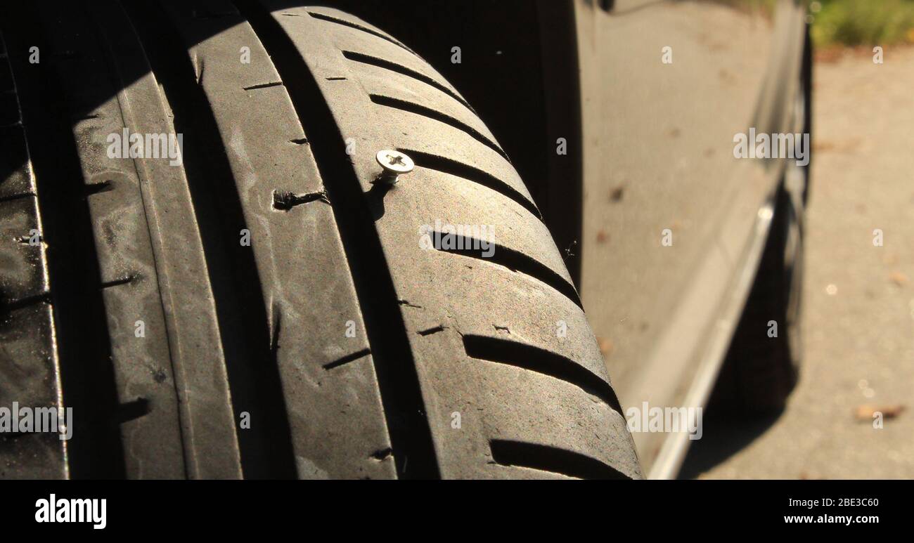 Punctured tire hi-res stock photography and images - Alamy