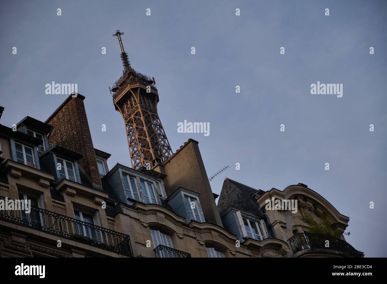 Eiffel Tower Behind Chimney Stacks Stock Photo - Alamy
