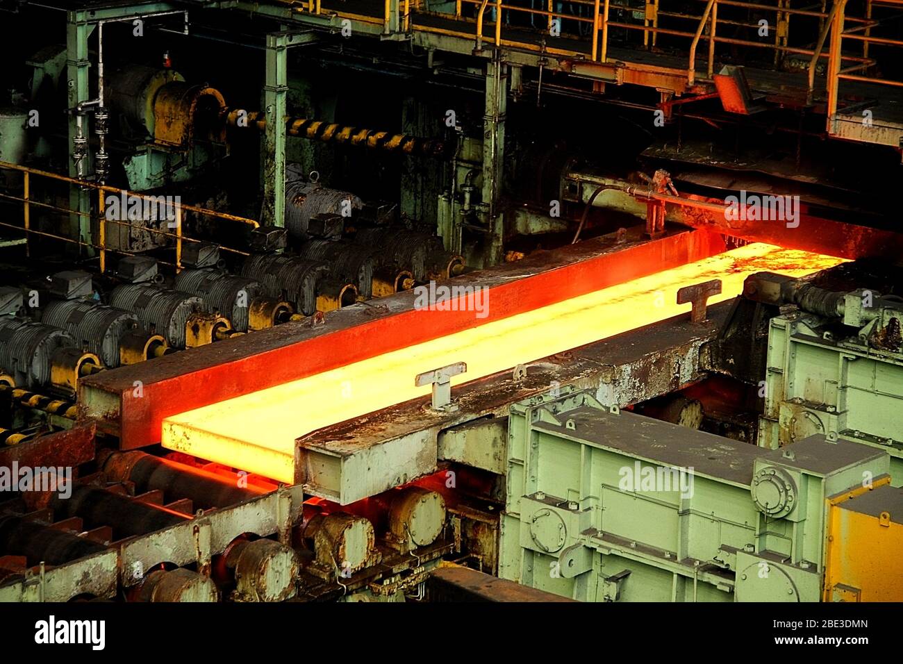 Hot steel beam on the conveyor at steelworks industry plant Stock Photo ...