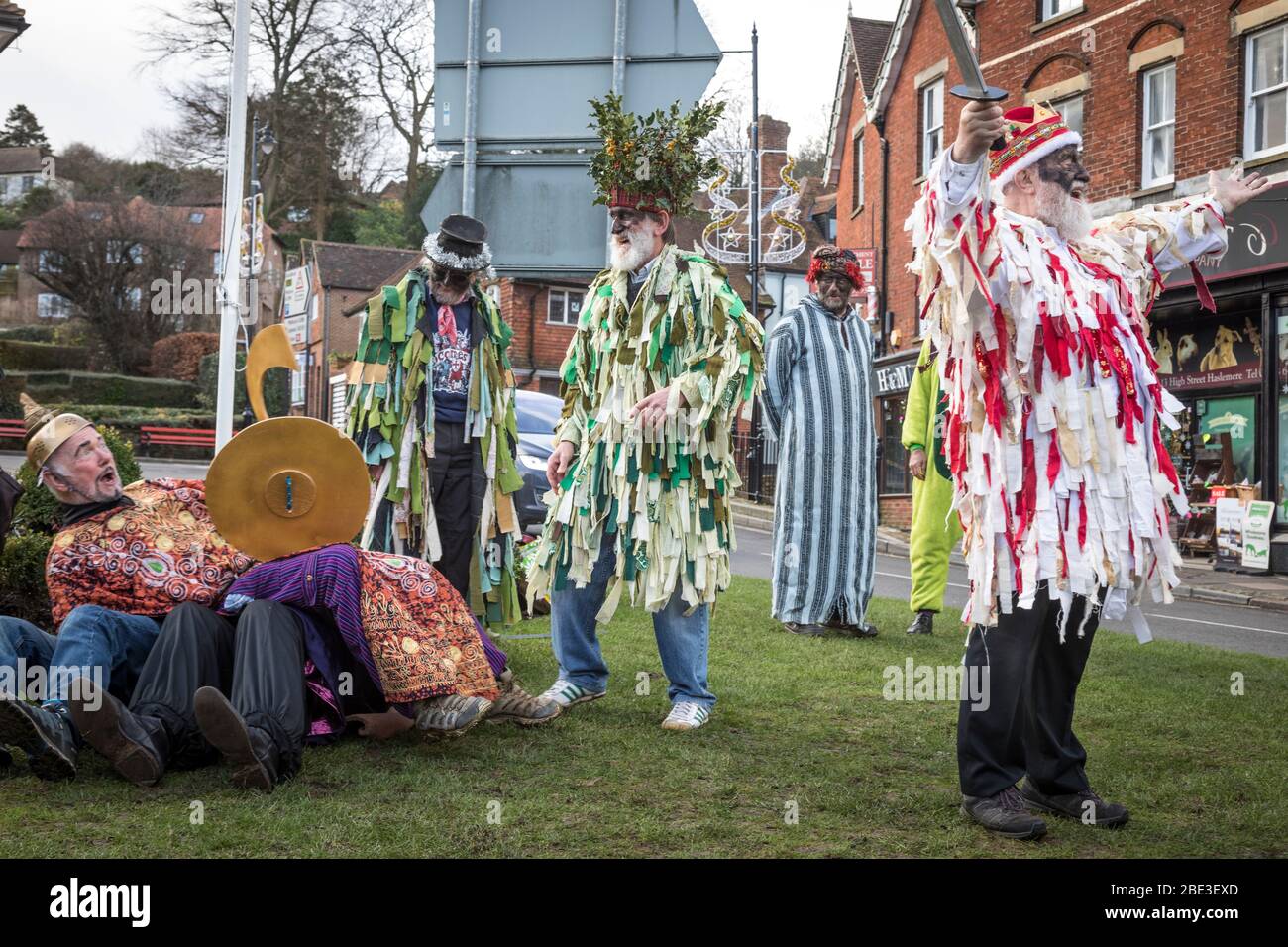 Mummers dressed in traditional costume perform in the centre of ...