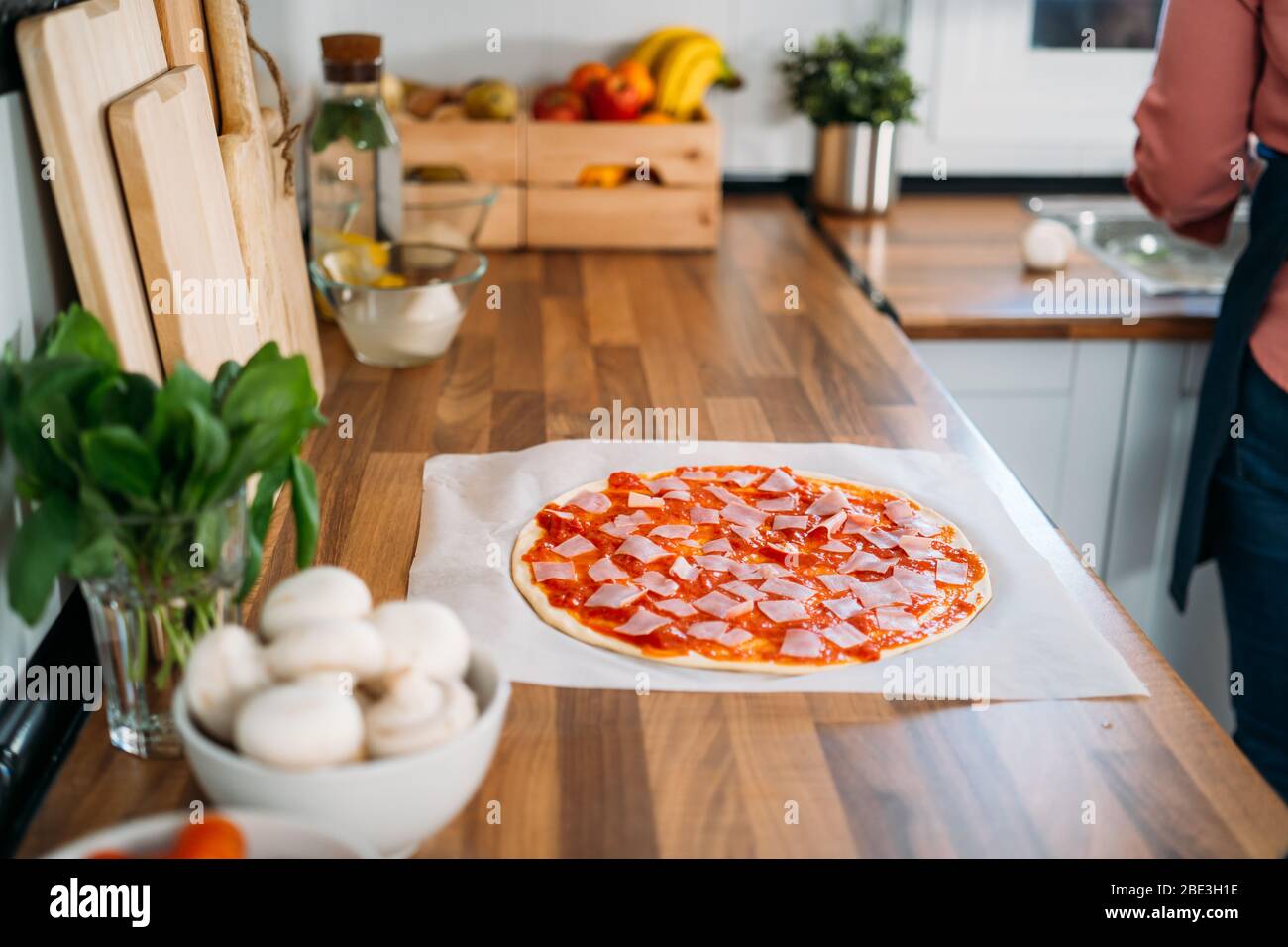 Woman preparing a traditional Italian pizza. The original process of ...