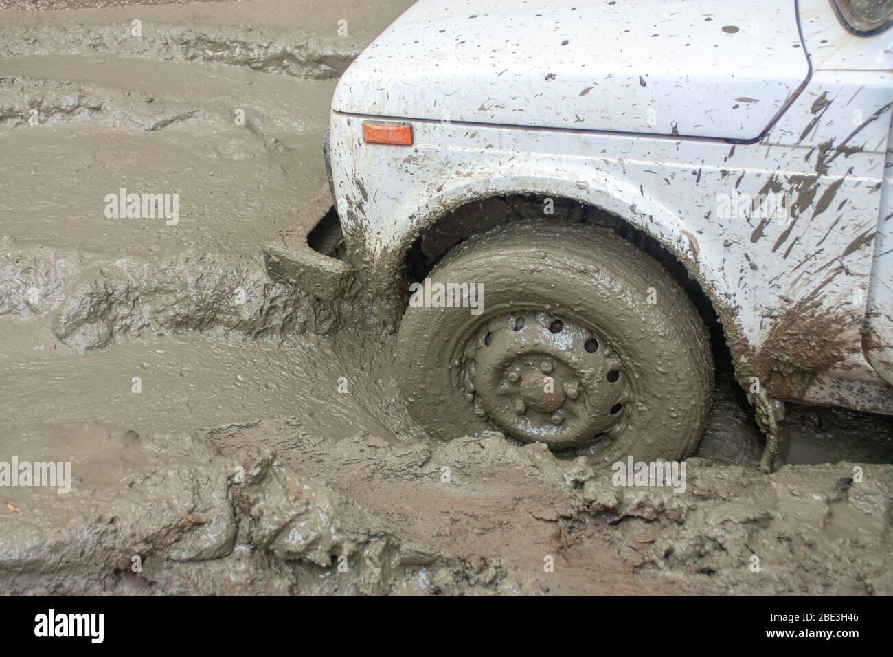 car on muddy road Stock Photo - Alamy