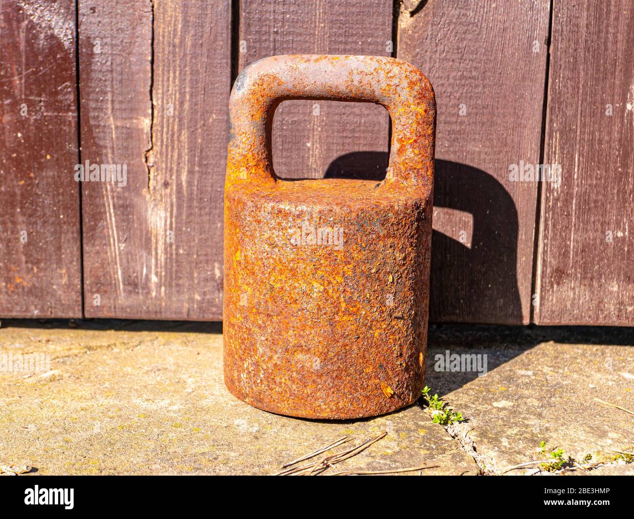 Old rusty iron weight for large weights Stock Photo - Alamy