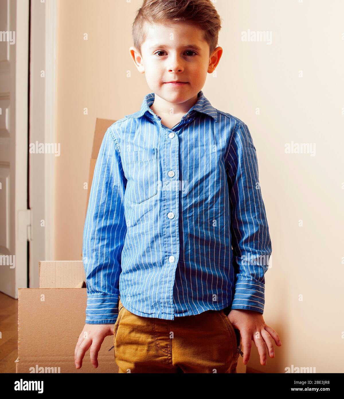 little cute boy in empty room, remoove to new house. home alone ...