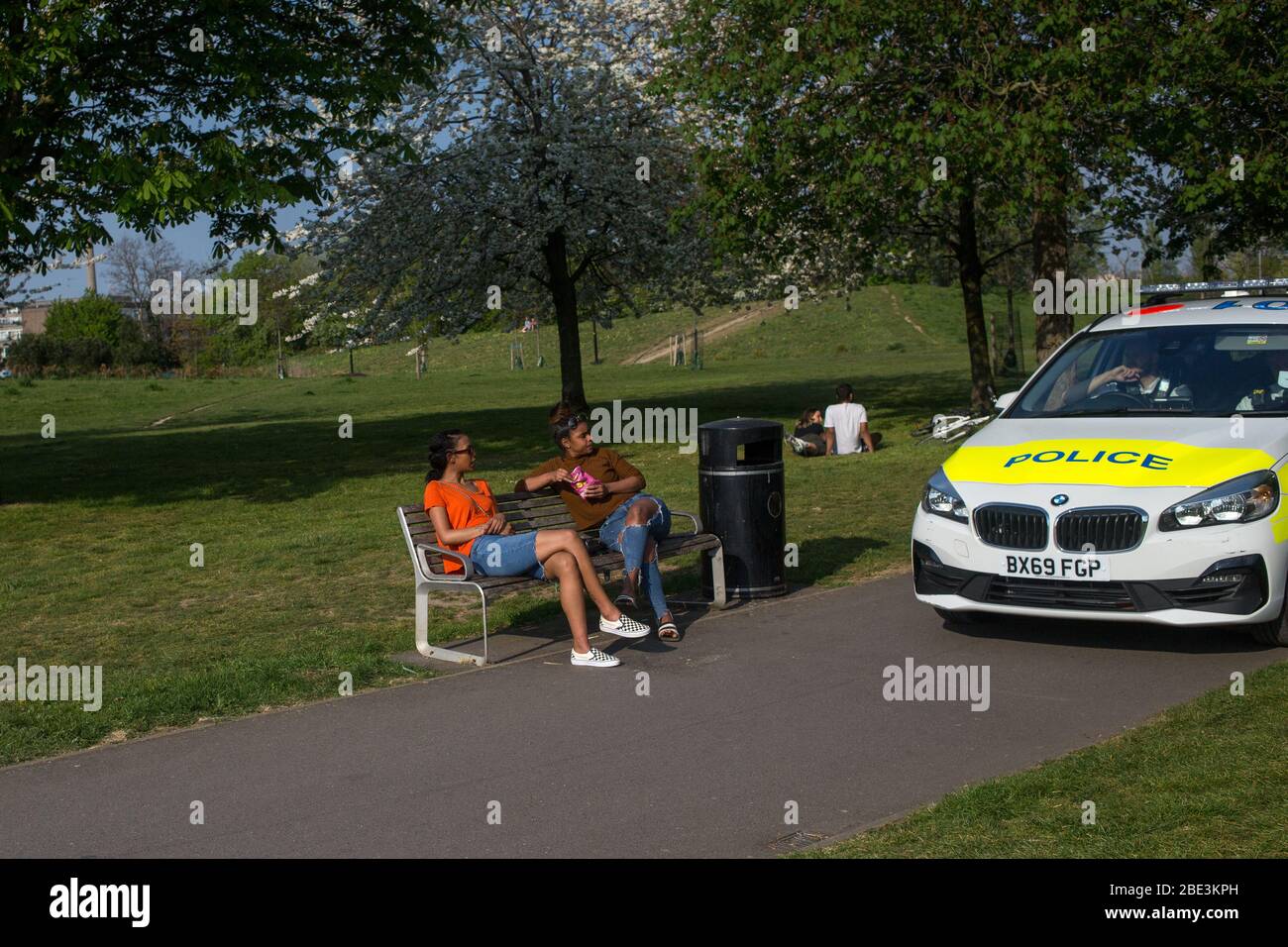 London UK 11th April 2020 Police drive a Patrol car around Burgess park ...