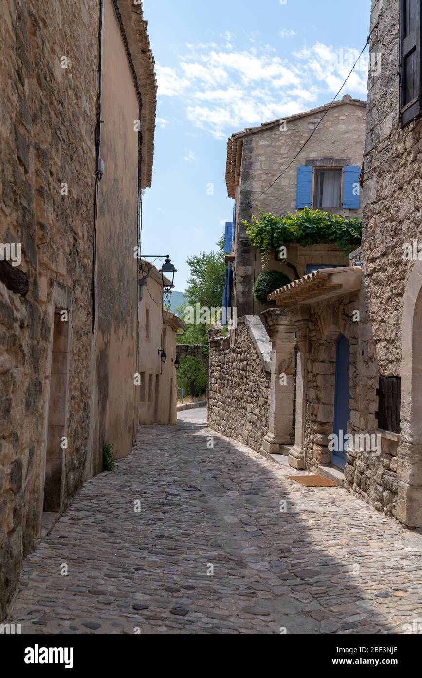 Lacoste village in Vaucluse Provence France ancient stone alley in the ...