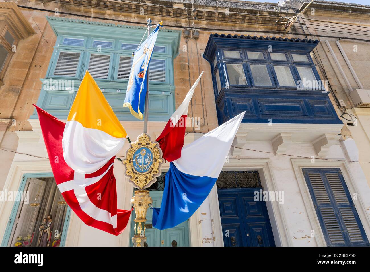 Flags displayed in street, Rabat, Malta Stock Photo - Alamy