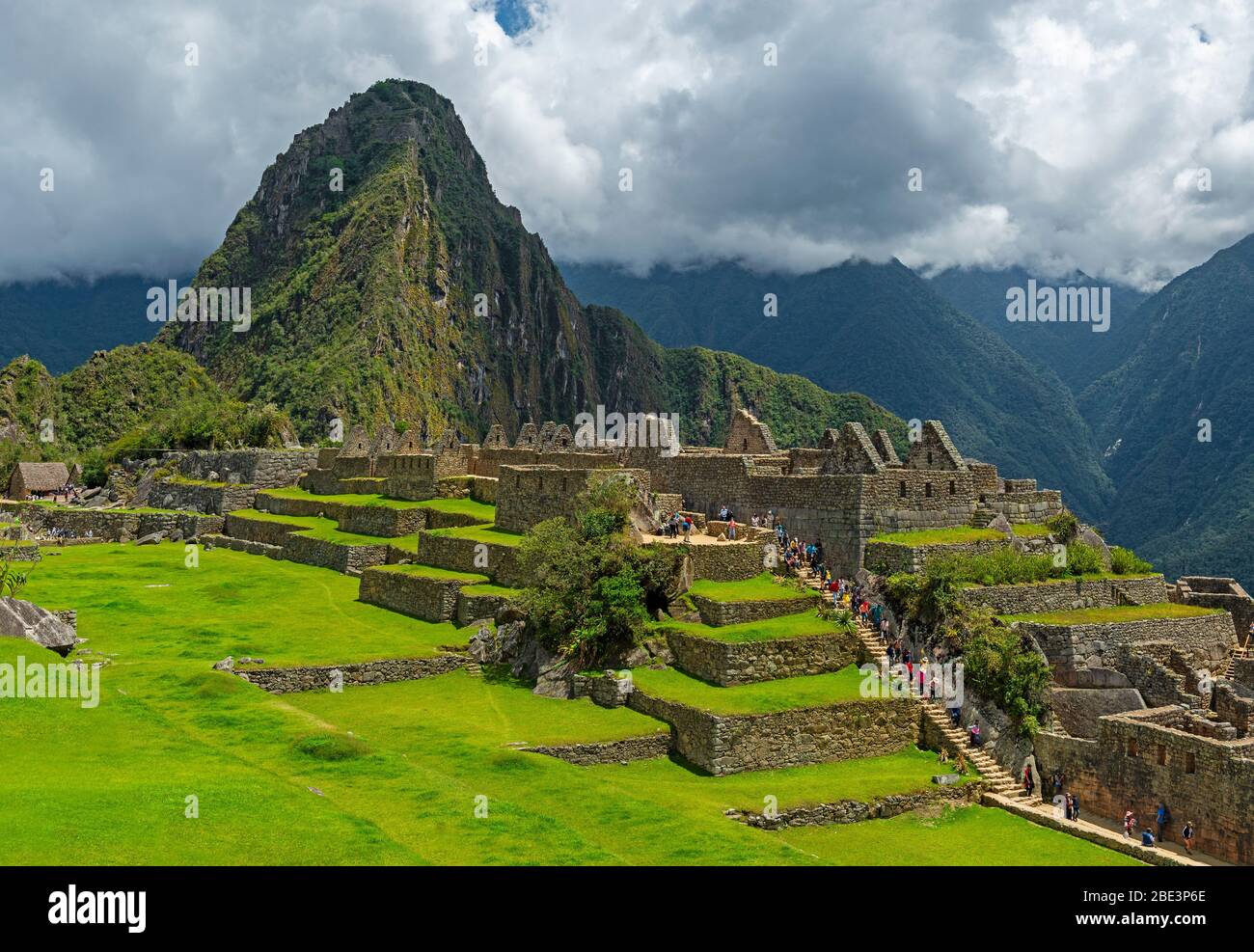 Main Square of Machu Picchu Ruin with agriculture fields and tourists ...