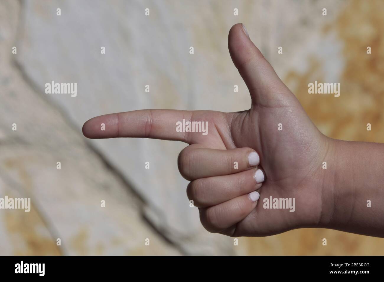Girl's hand with white painted nails performing different signs Stock ...