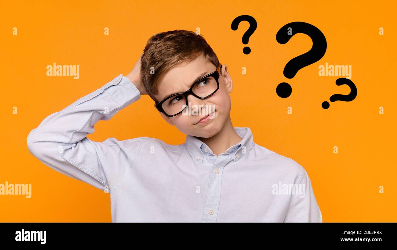 Boy scratching head hi-res stock photography and images - Alamy