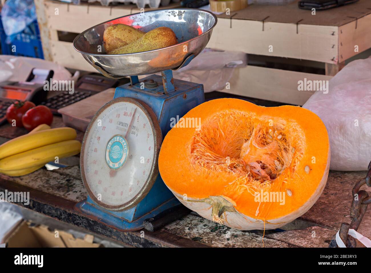 Cut melon and fruit being weighed at roadside fruit stand, St Paul's ...