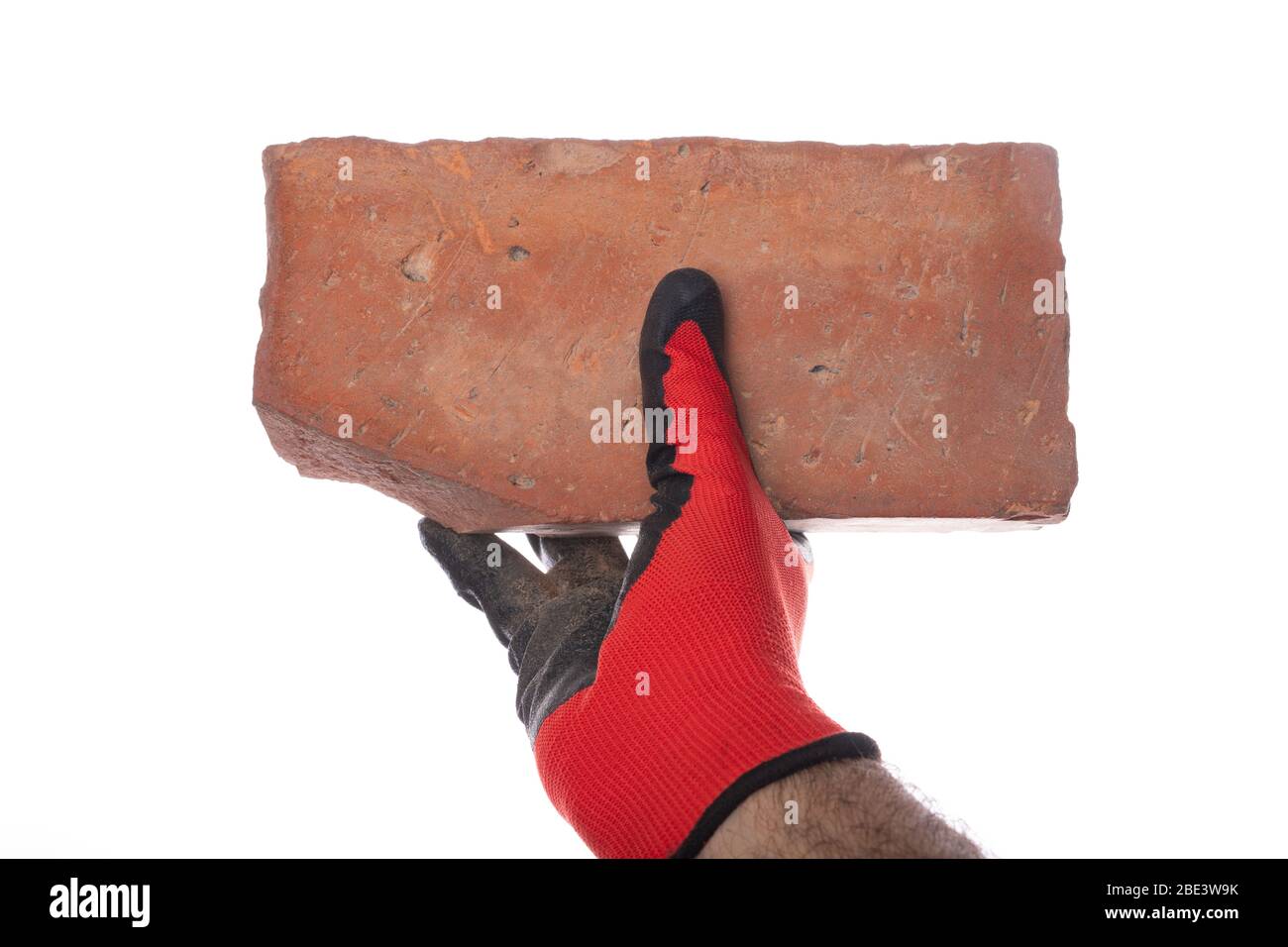 Red brick kept in hand. Clay brick and glove. Light background Stock ...