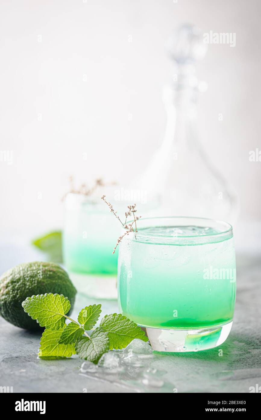 glass of cold drink with fresh mint leaves and ice cubes Stock Photo ...