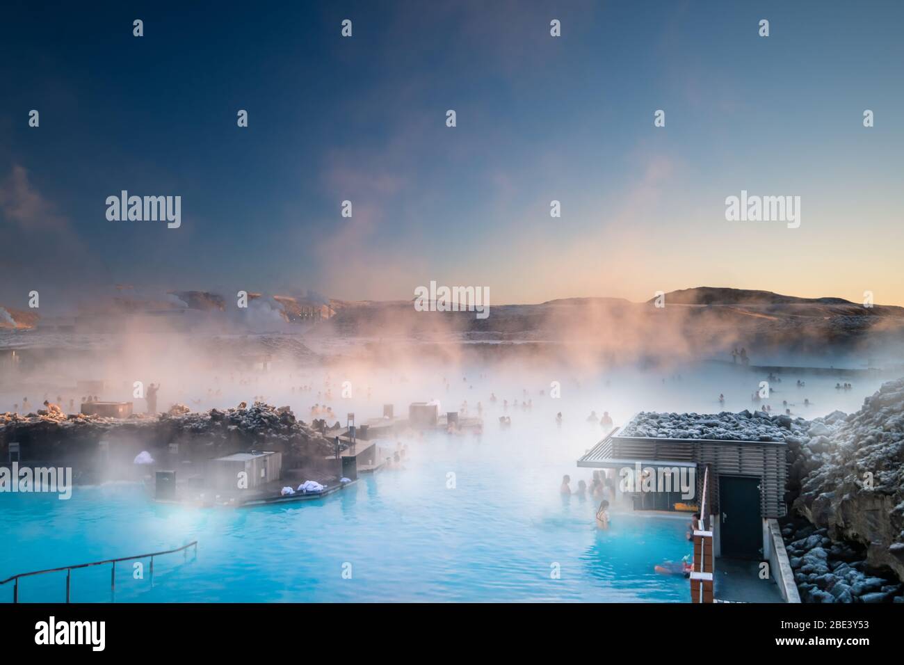 Blue lagoon hot spring geothermal spa at sunset in winter in Iceland ...