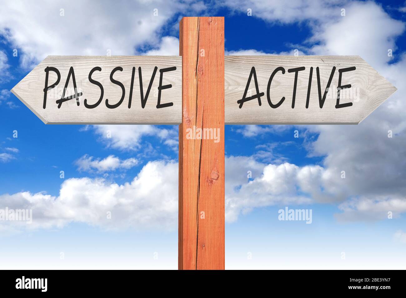Passive or active - wooden signpost Stock Photo - Alamy