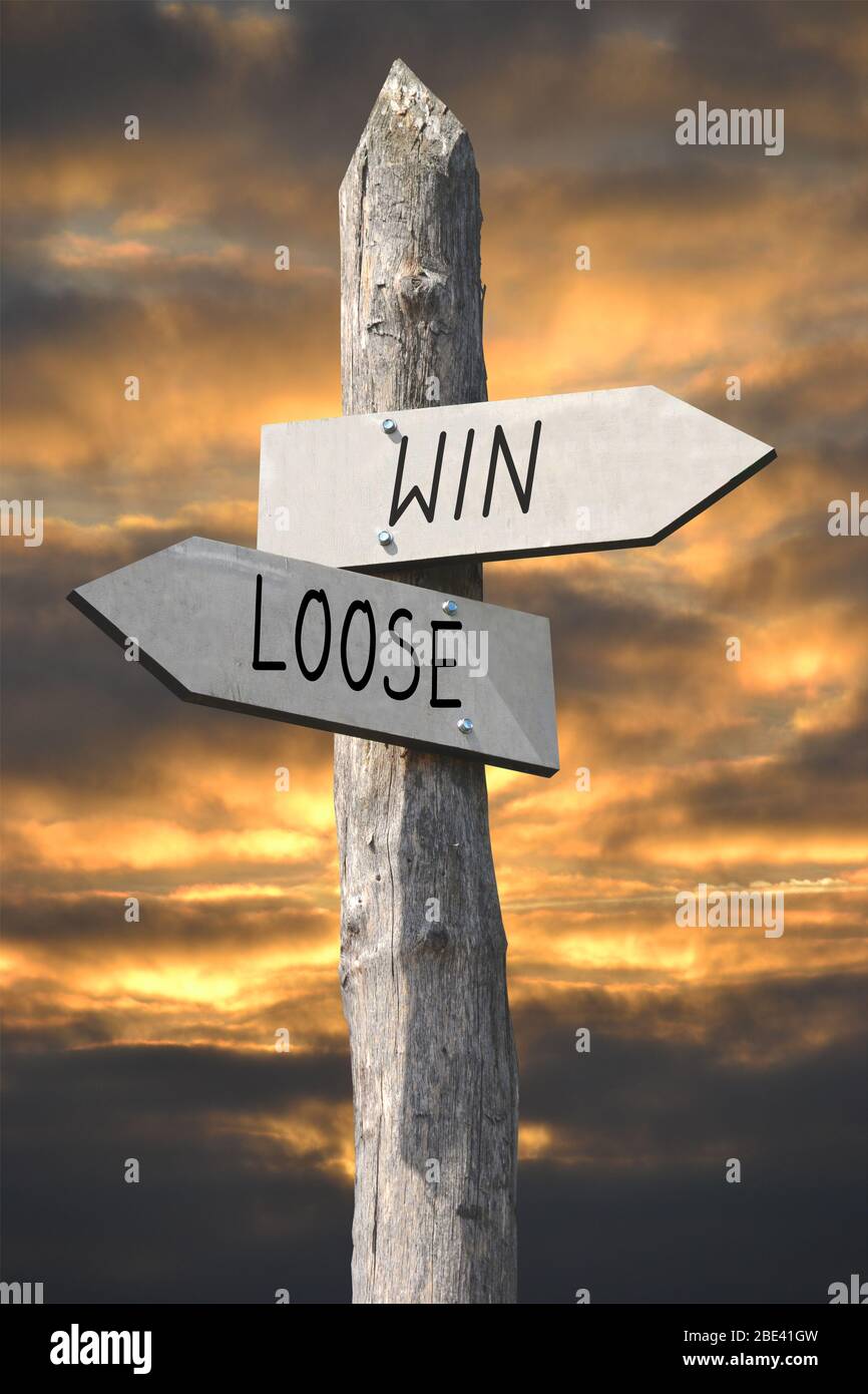 Win or loose signpost Stock Photo - Alamy